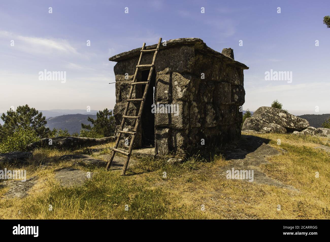 Closeup shot of a beautiful stone barn in the countryside mountains on ...