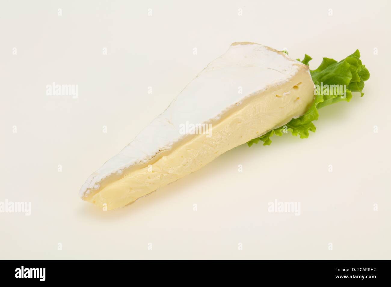 Brie cheese triangle served salad leaves Stock Photo - Alamy