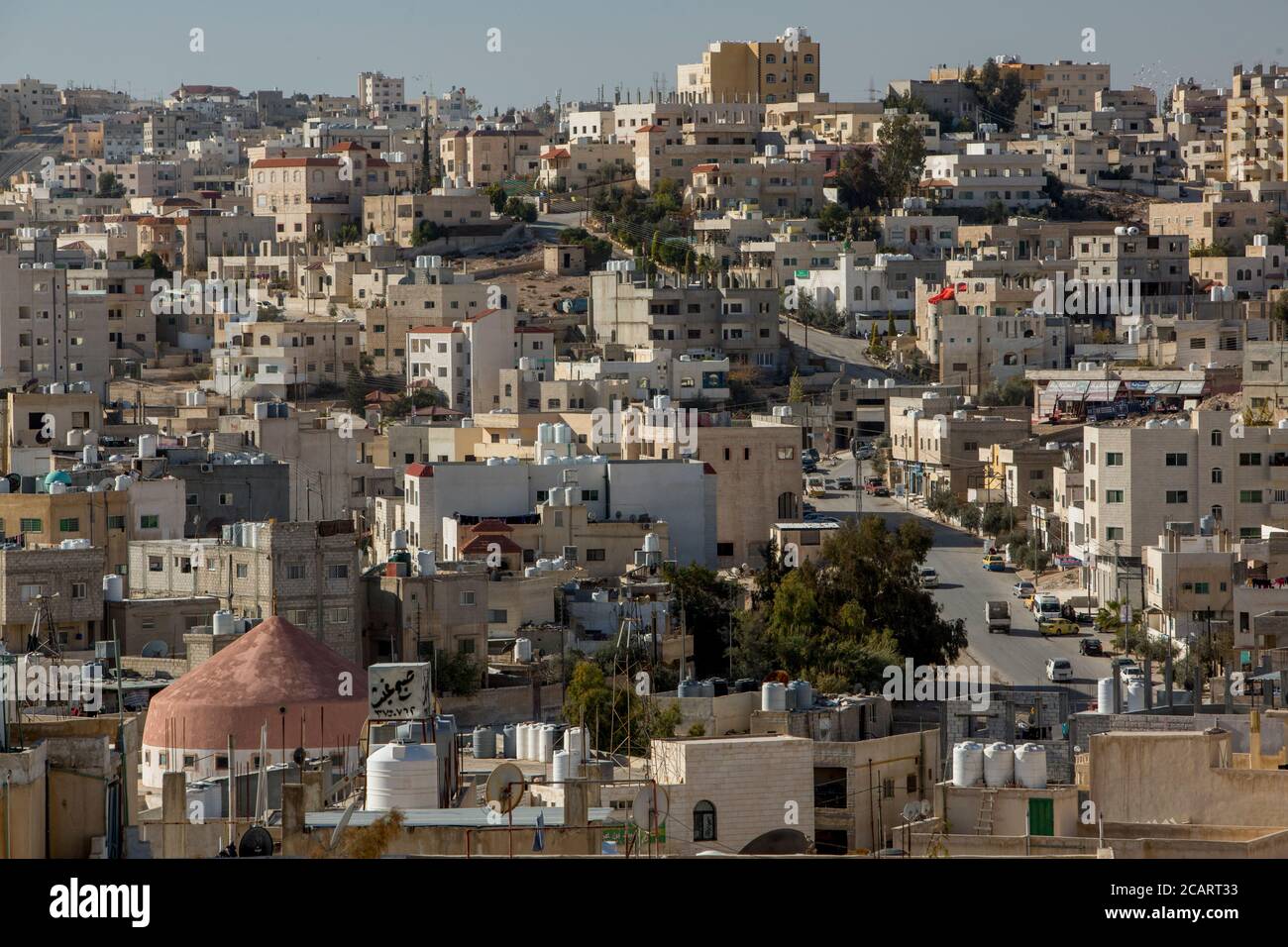 Rooftop water storage tanks are a common site in the arid city of Zarqa ...