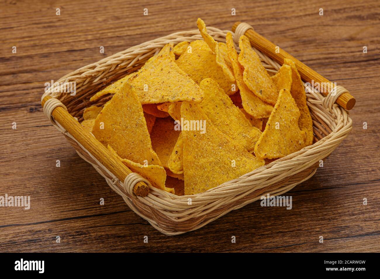 Mexican crunchy corn nachos triangle heap Stock Photo - Alamy