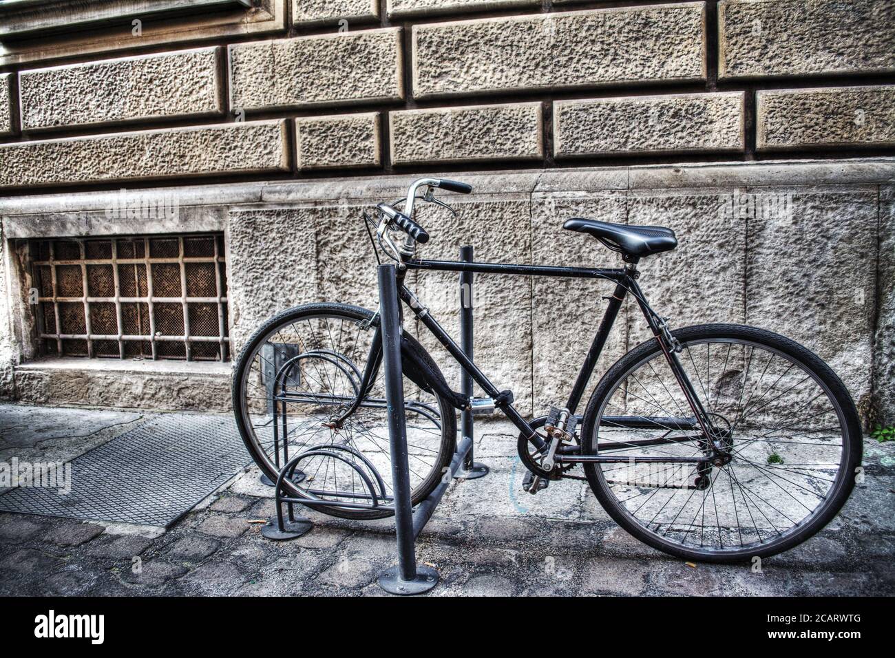 bicycle in a bike rack in Bologna, Italy Stock Photo - Alamy