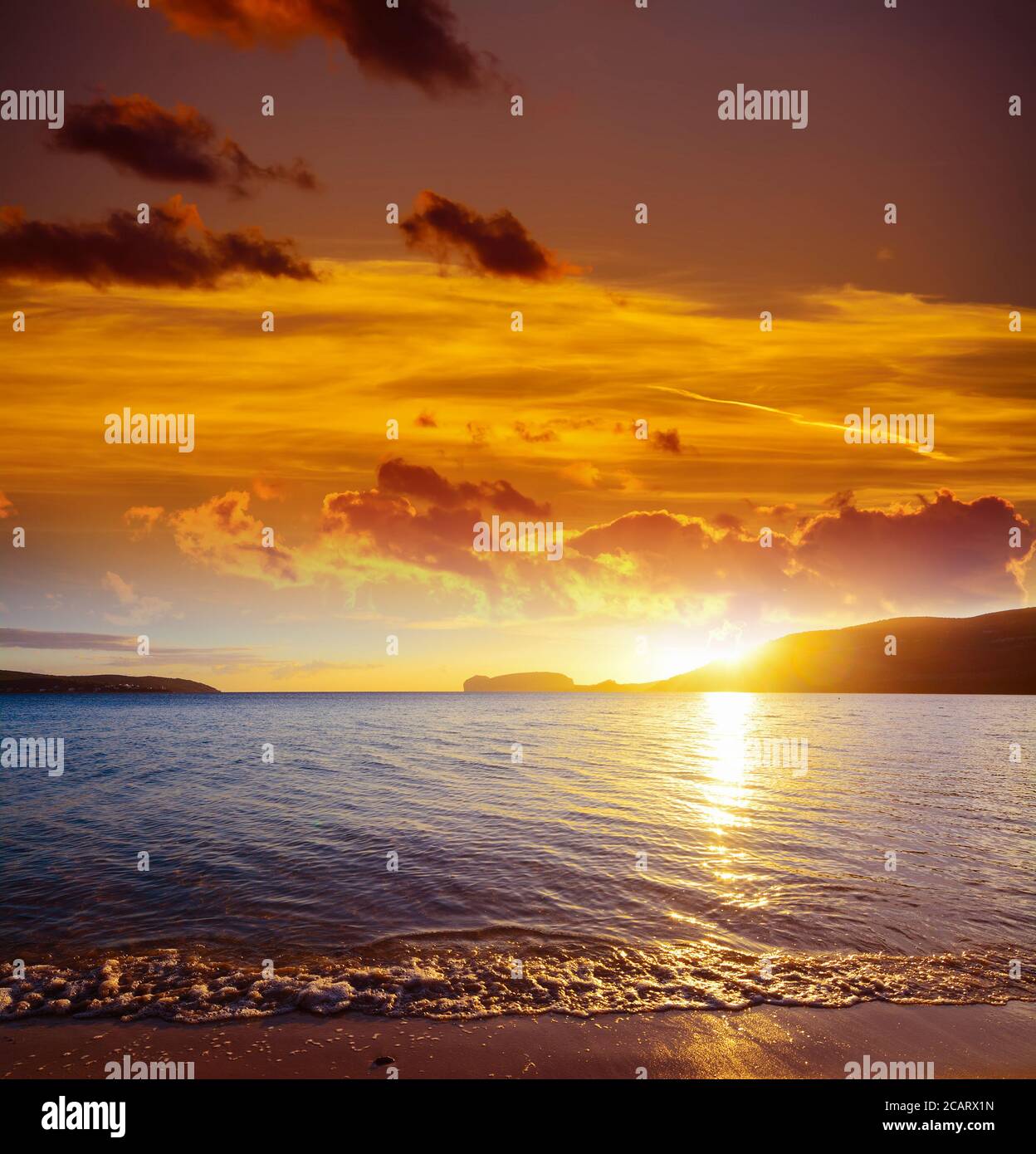 colorful sky over Mugoni beach at sunset, Sardinia Stock Photo - Alamy