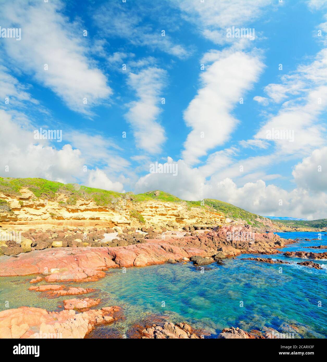 red rocks by the sea in Sardinia, Italy Stock Photo - Alamy