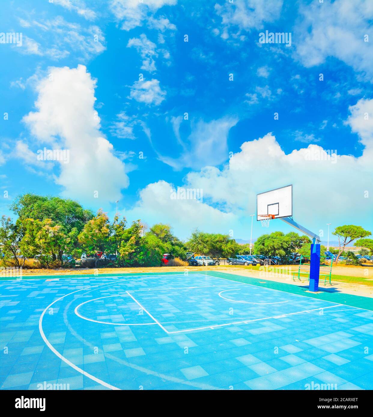 blue playground under a cloudy sky Stock Photo - Alamy