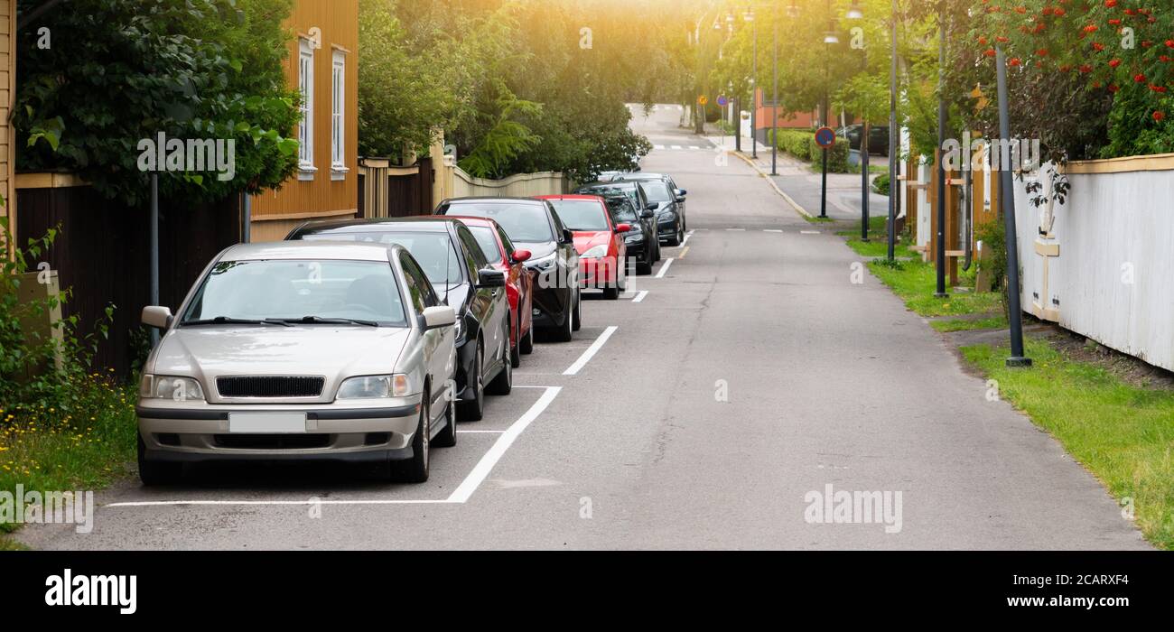 Cars are parked on a city street Stock Photo - Alamy