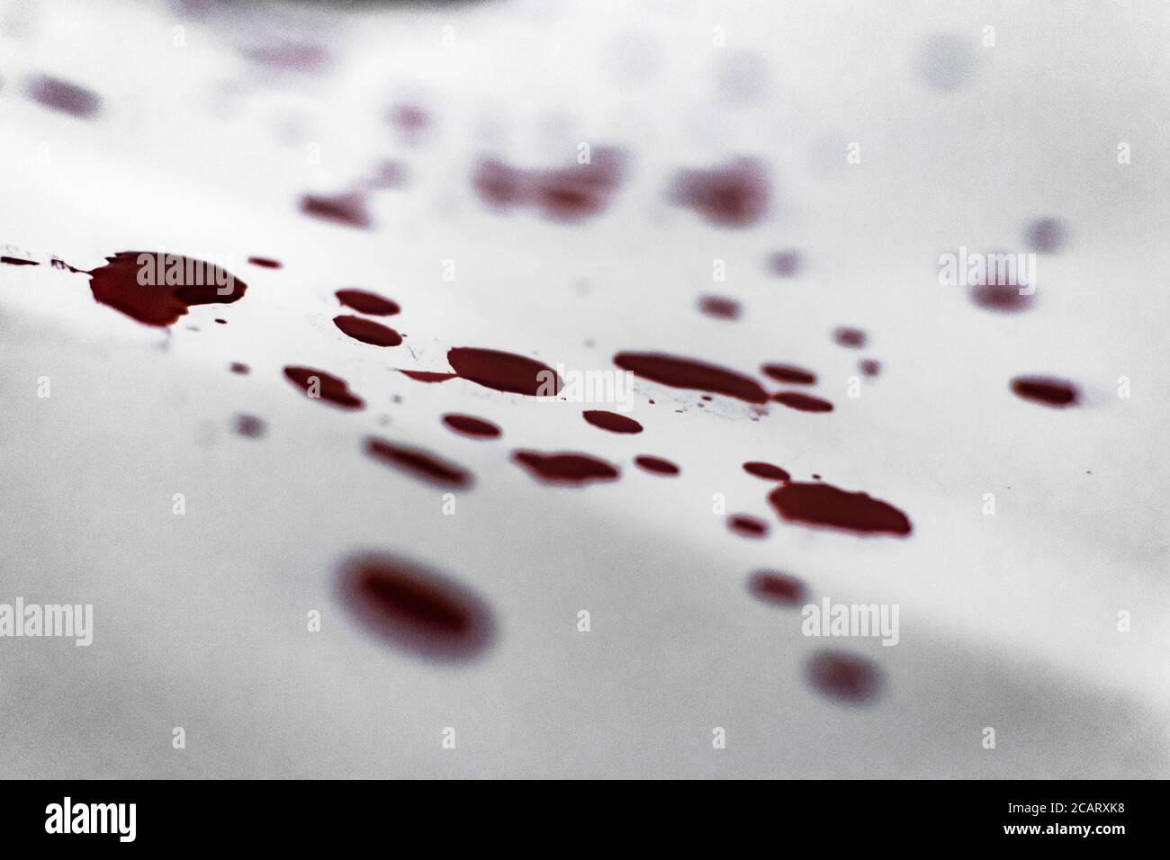 red blood drops on a white background shallow dof coloring Stock Photo ...