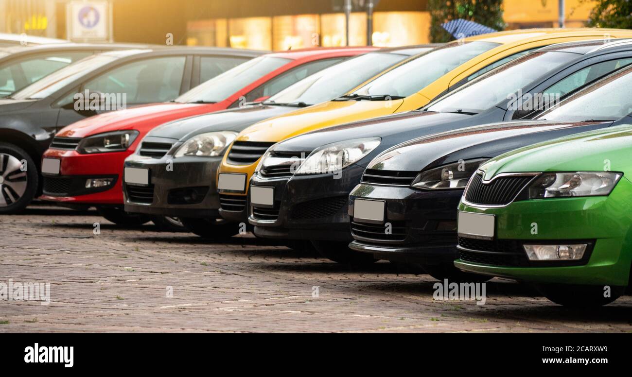 Cars are parked on a city street Stock Photo - Alamy