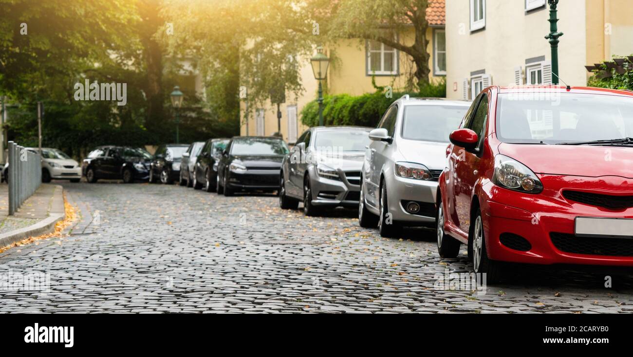 Cars are parked on a city street Stock Photo - Alamy