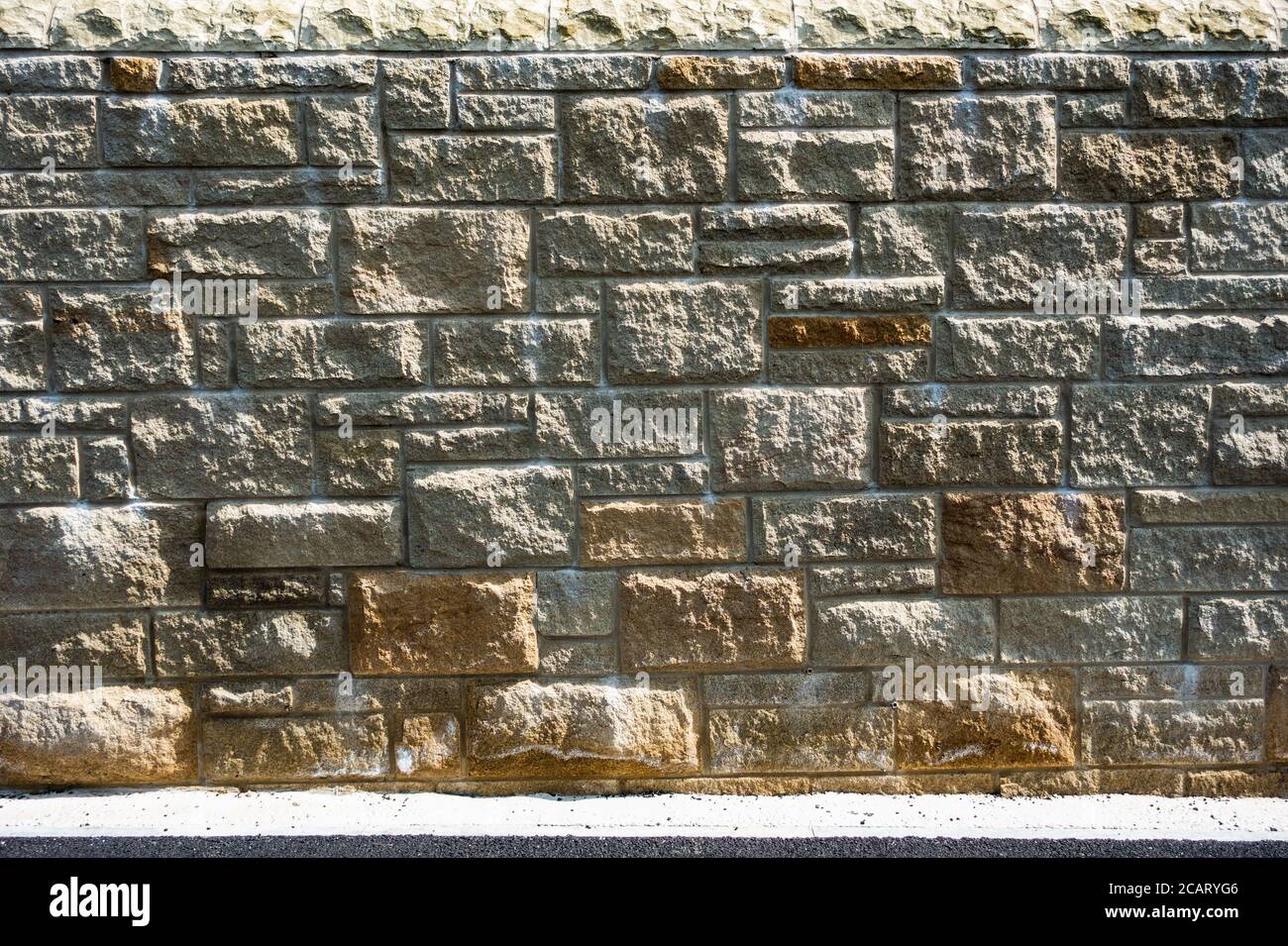 Weathered stone wall with a random pattern Stock Photo - Alamy