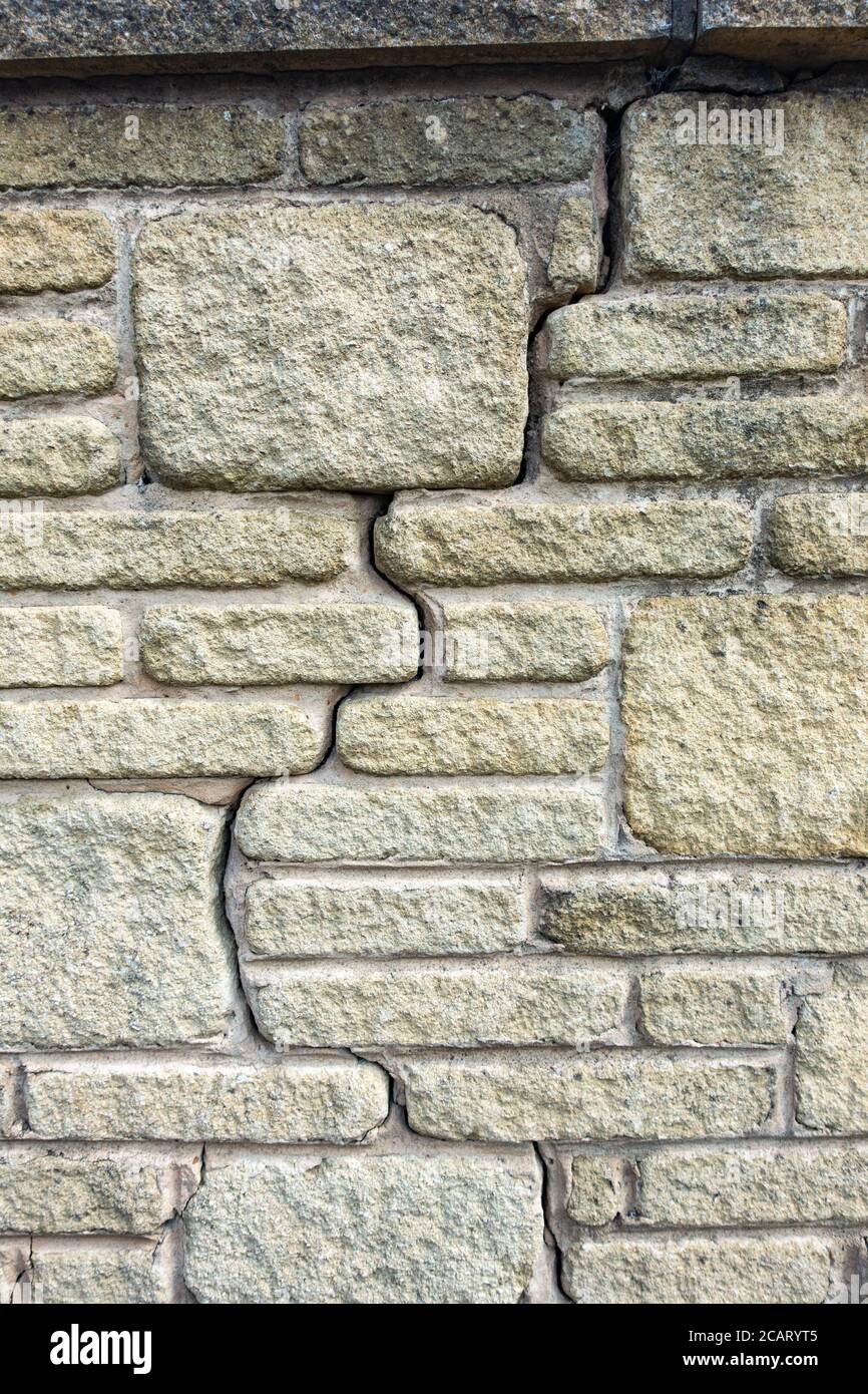 vertical crack in an old stone wall Stock Photo - Alamy