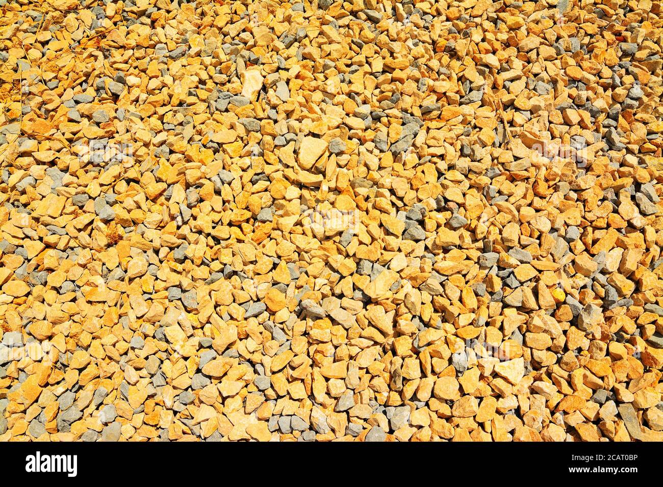 background made with yellow gravel close up Stock Photo - Alamy