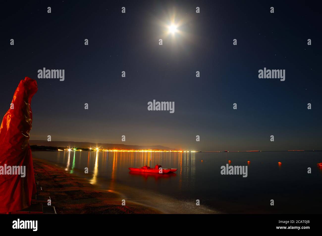 parasol and boat on a starry night in Alghero, Sardinia Stock Photo - Alamy