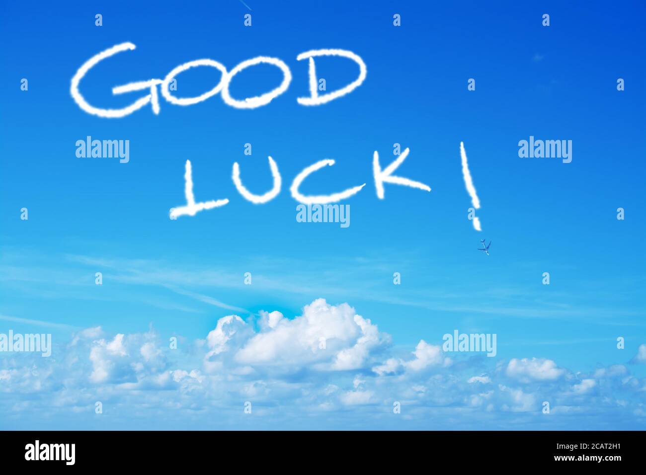 good luck written in the sky with an airplane contrail Stock Photo - Alamy