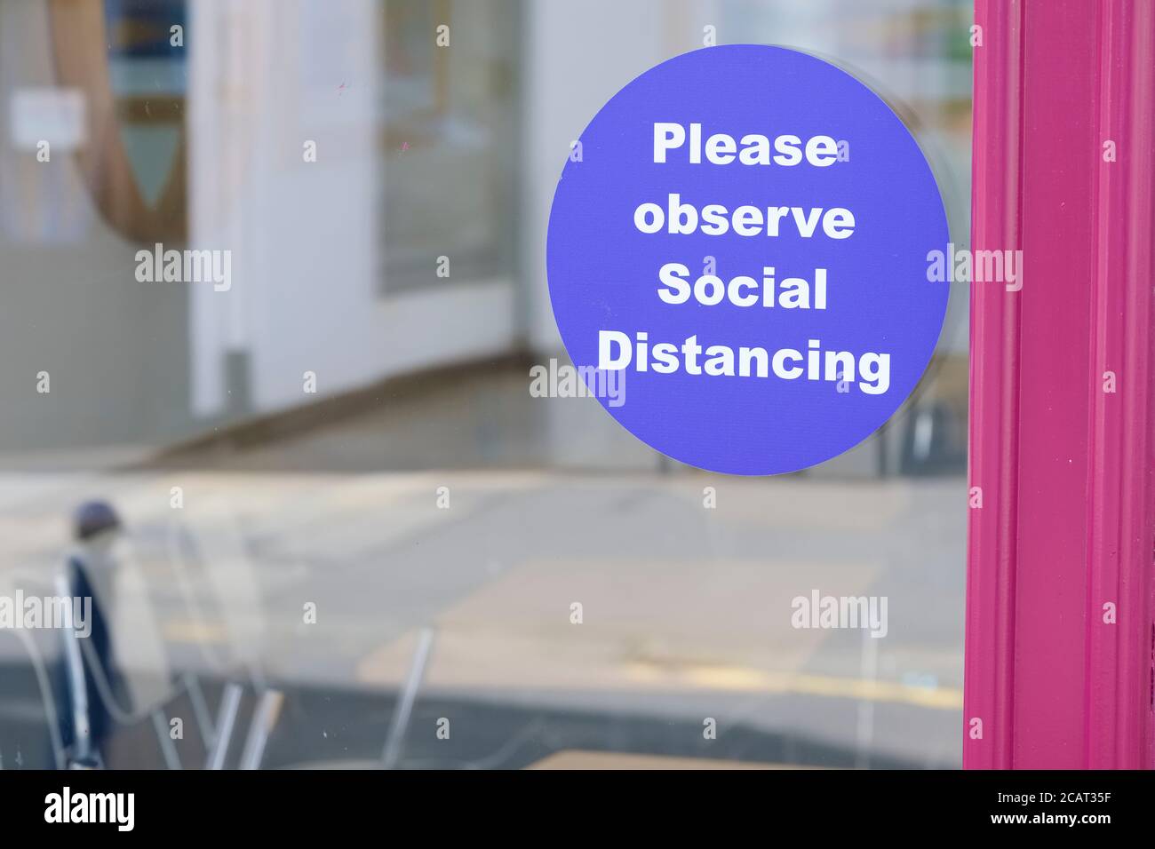 Social distancing sign for shop business customer queue Stock Photo - Alamy