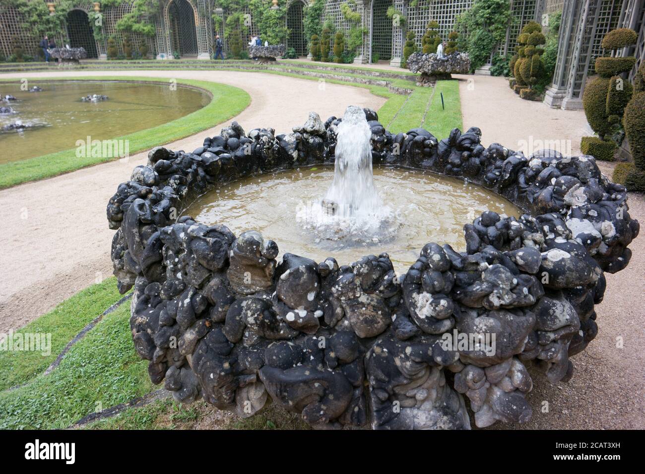 Closeup shot of a round fountain patterned with stone pieces in the ...