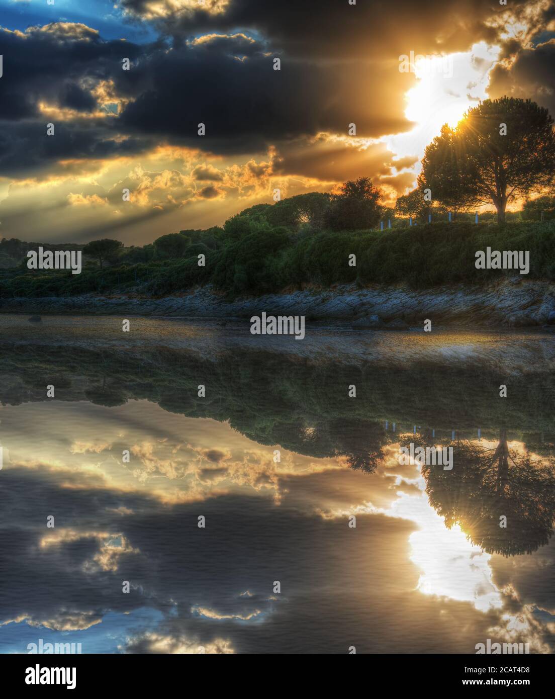 reflection on the sea at sunset Stock Photo - Alamy