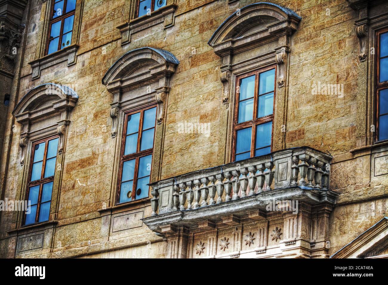 typical Tuscan balcony in a yellow building, Italy Stock Photo - Alamy