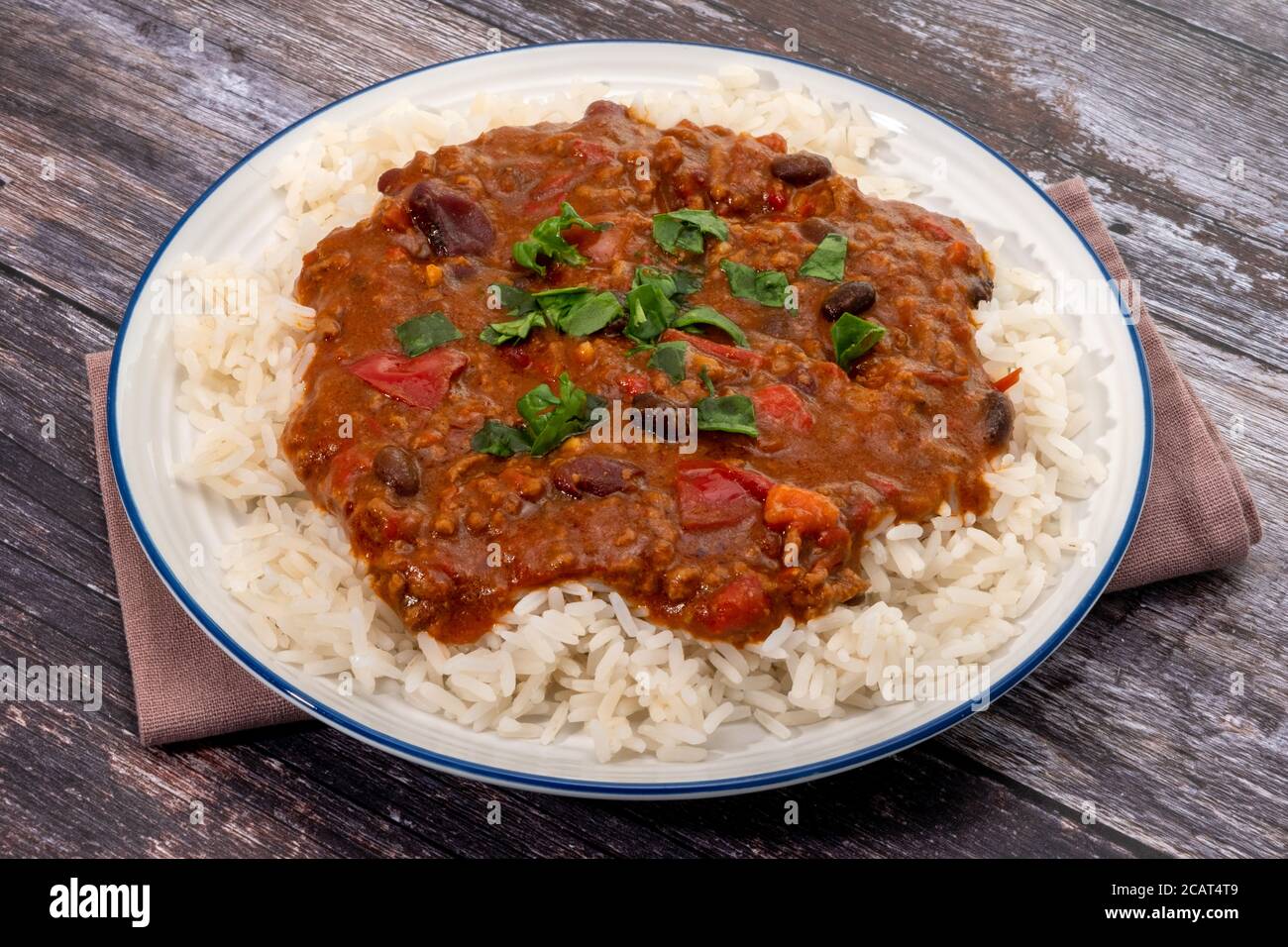 Chilli con carne with white rice Stock Photo - Alamy