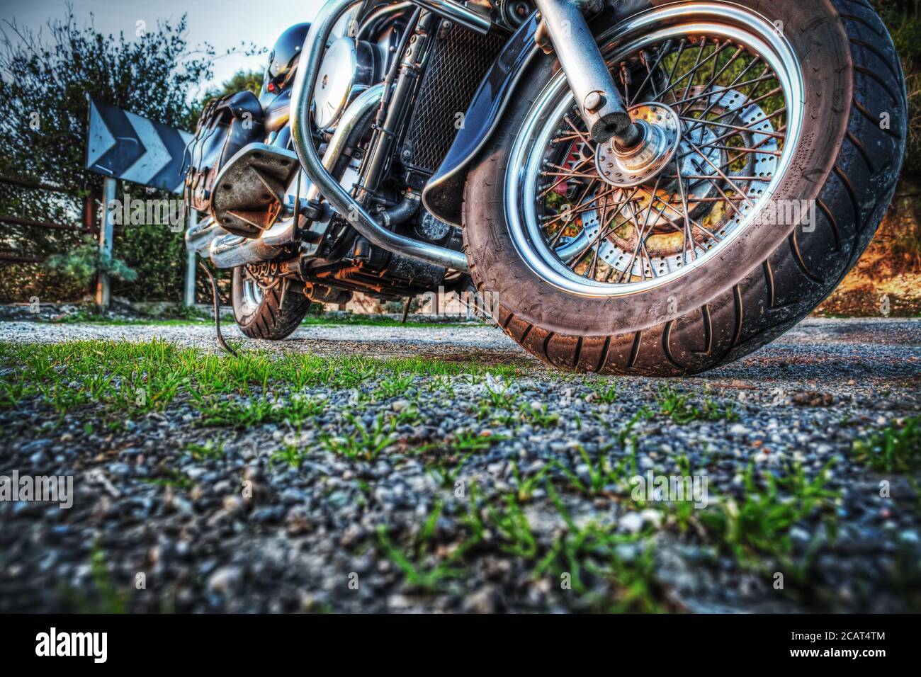 close up of a classic motorcycle seen from the ground in hdr tone ...