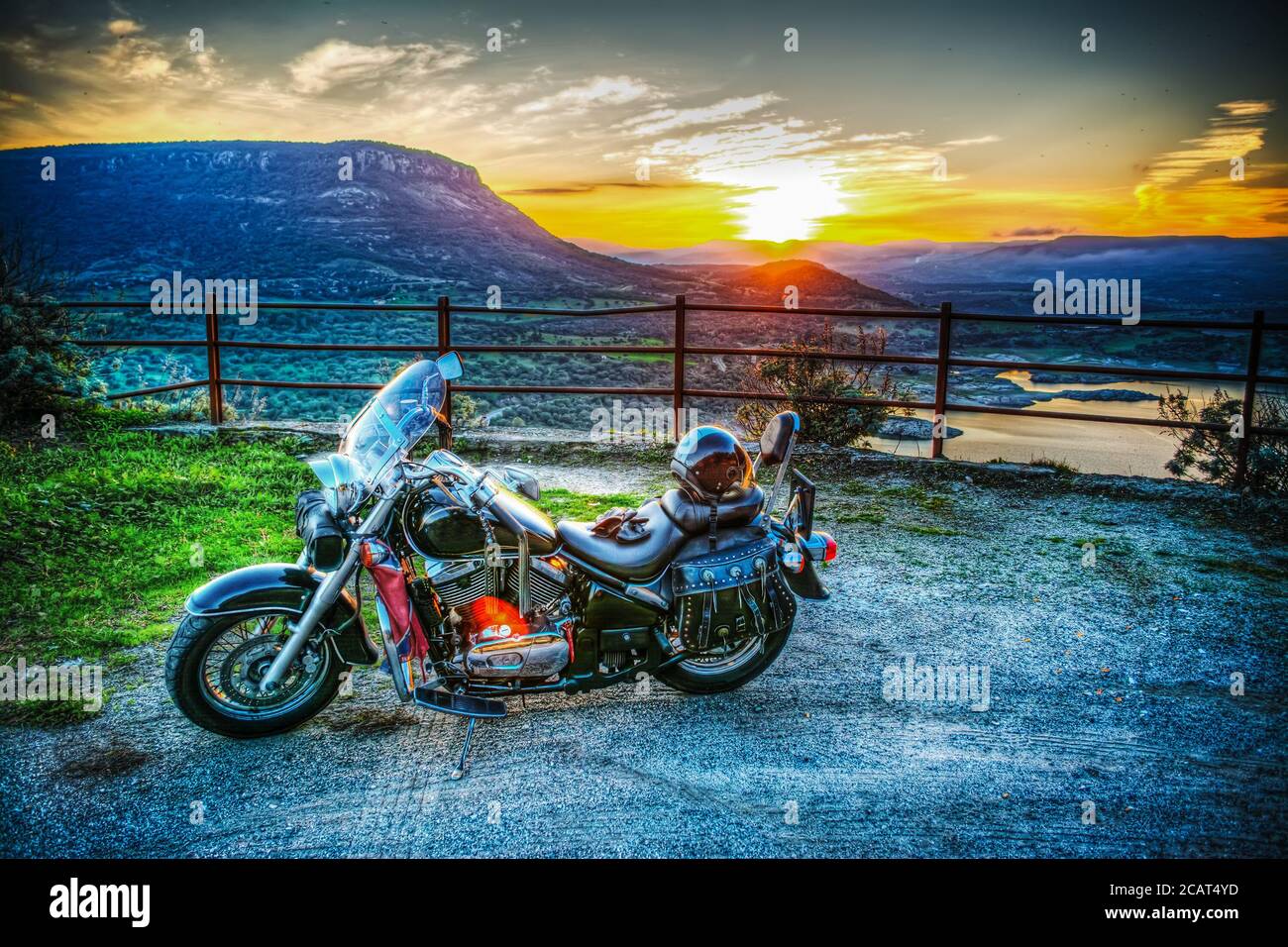 classic motorcycle on the edge of the road at sunset Stock Photo - Alamy