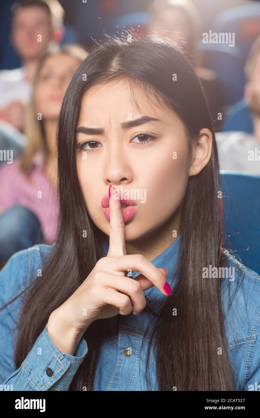 Asian woman shushing hi-res stock photography and images - Alamy