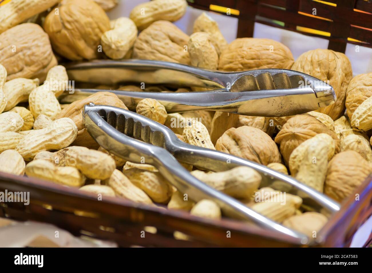 two nutcrackers on a bunch of peanuts Stock Photo - Alamy