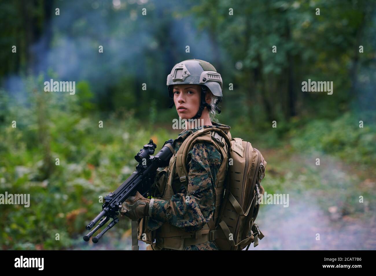 woman soldier ready for battle wearing protective military gear and ...