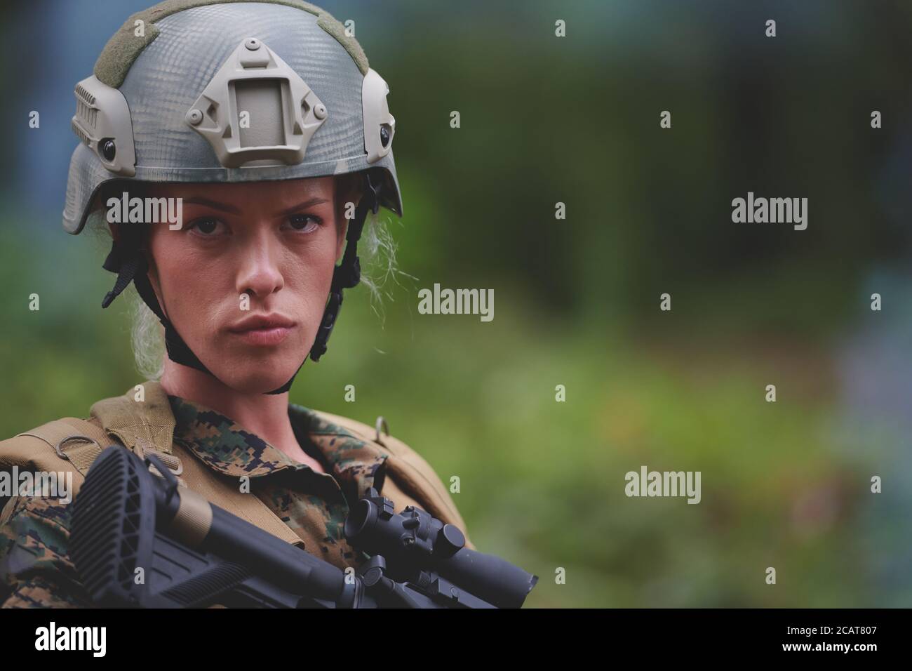 woman soldier ready for battle wearing protective military gear and ...