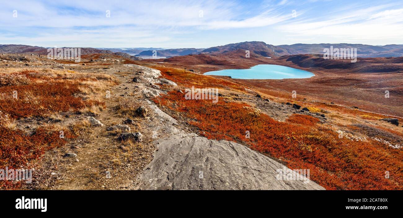 Autumn greenlandic orange tundra landscape with lakes and mountains in ...