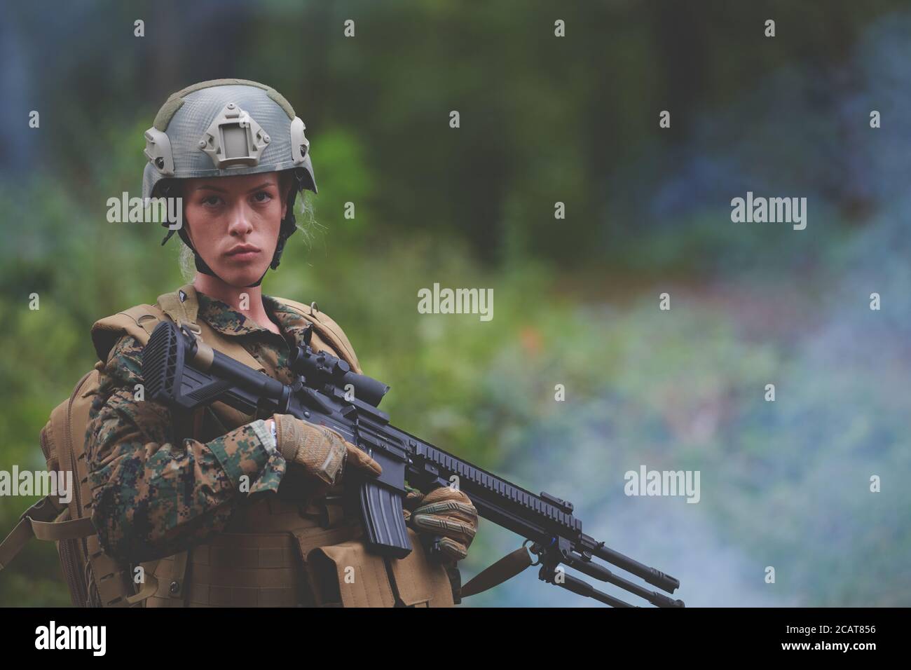 woman soldier ready for battle wearing protective military gear and ...