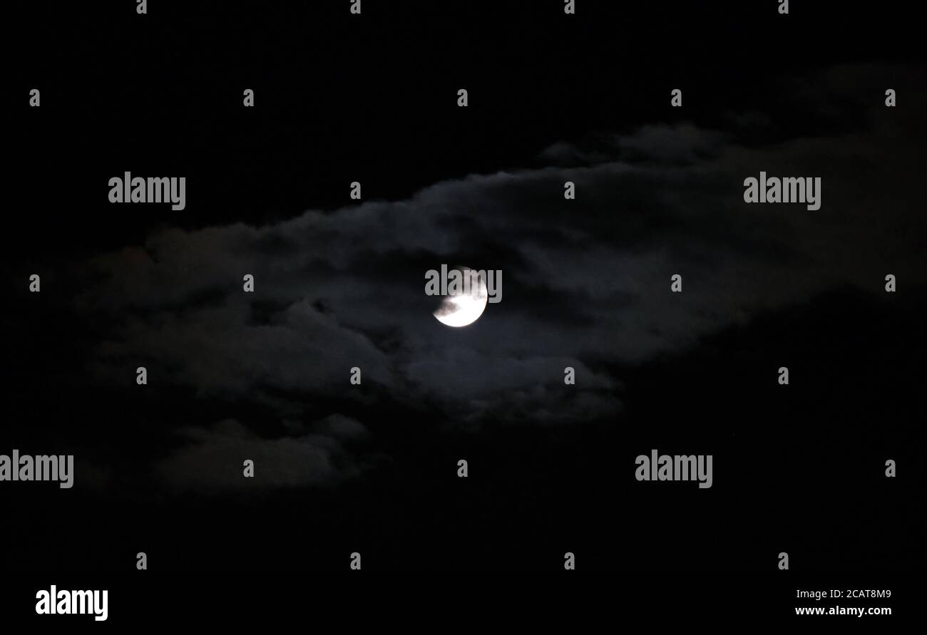 Cloudy Lunar Eclipse Stock Photo - Alamy