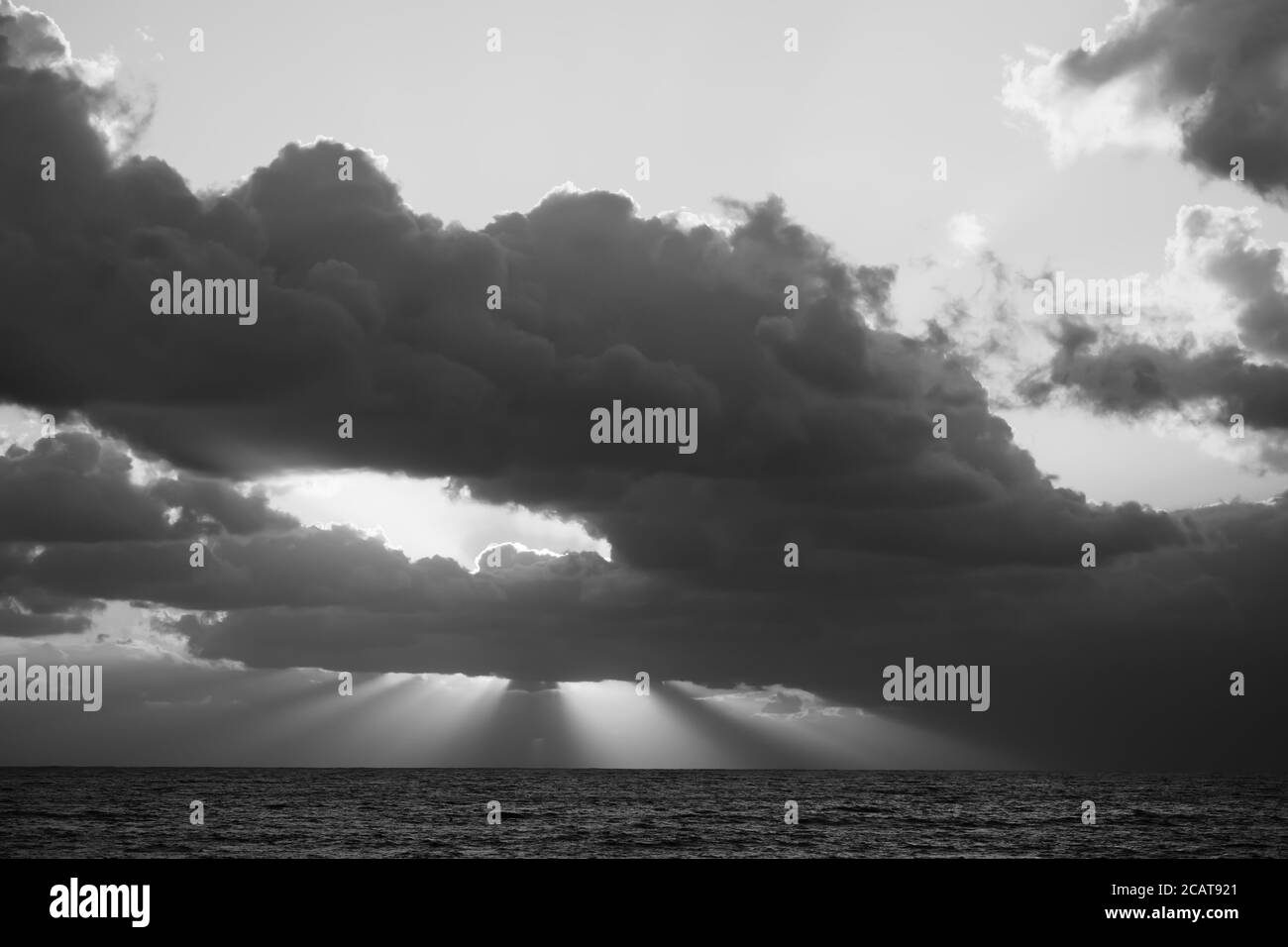 dramatic sky over the sea at sunset Stock Photo - Alamy