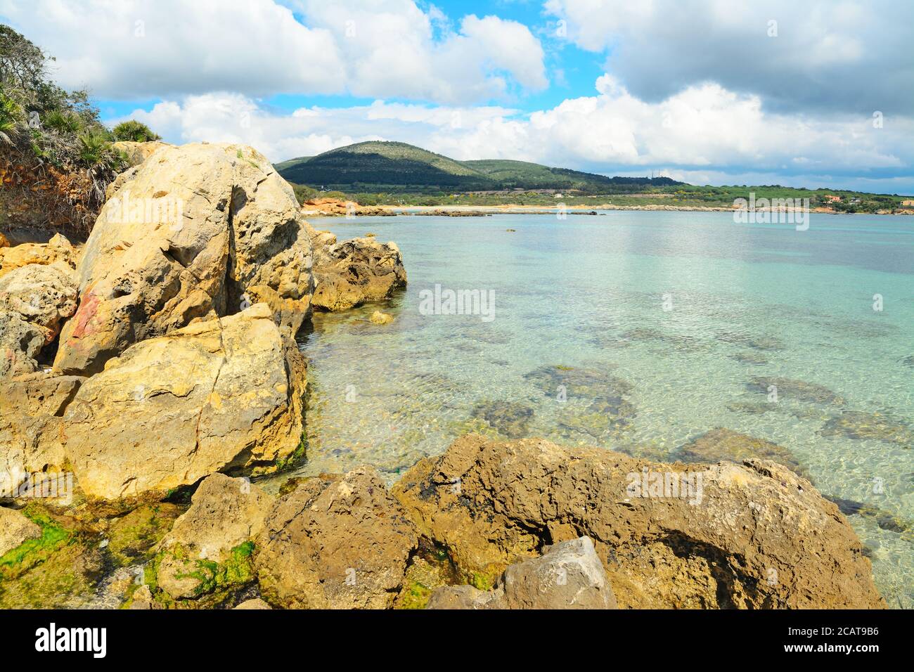 yellow rocks by the sea in Sardinia, Italy Stock Photo - Alamy