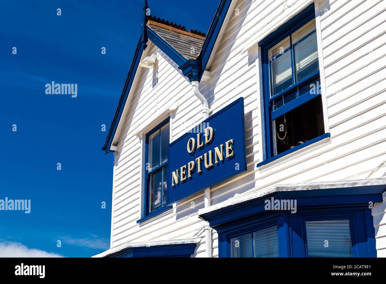 Blue and white facade of Old Neptune 19th century seaside pub ...
