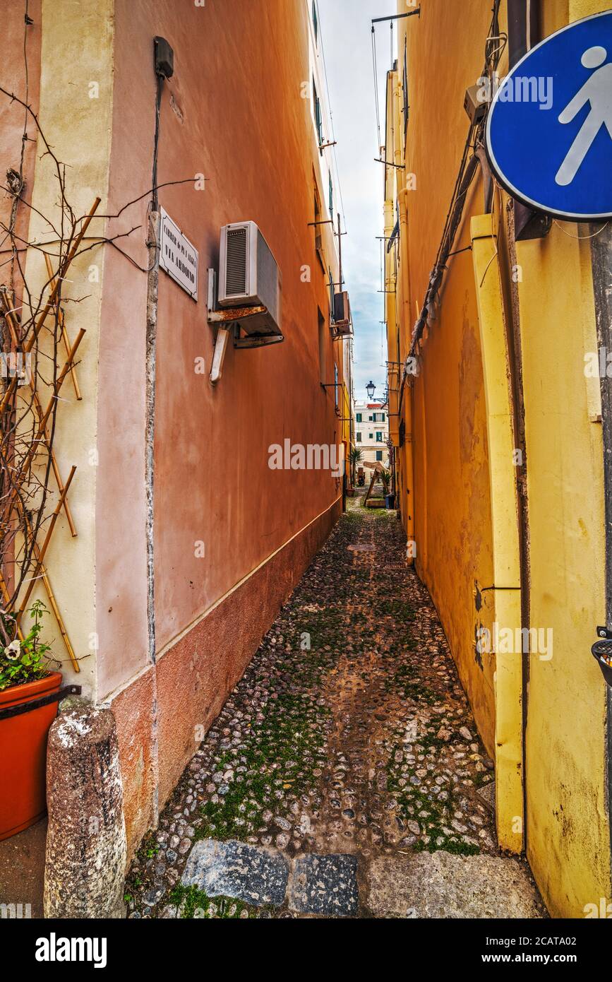 narrow street in Alghero old town, Italy Stock Photo - Alamy