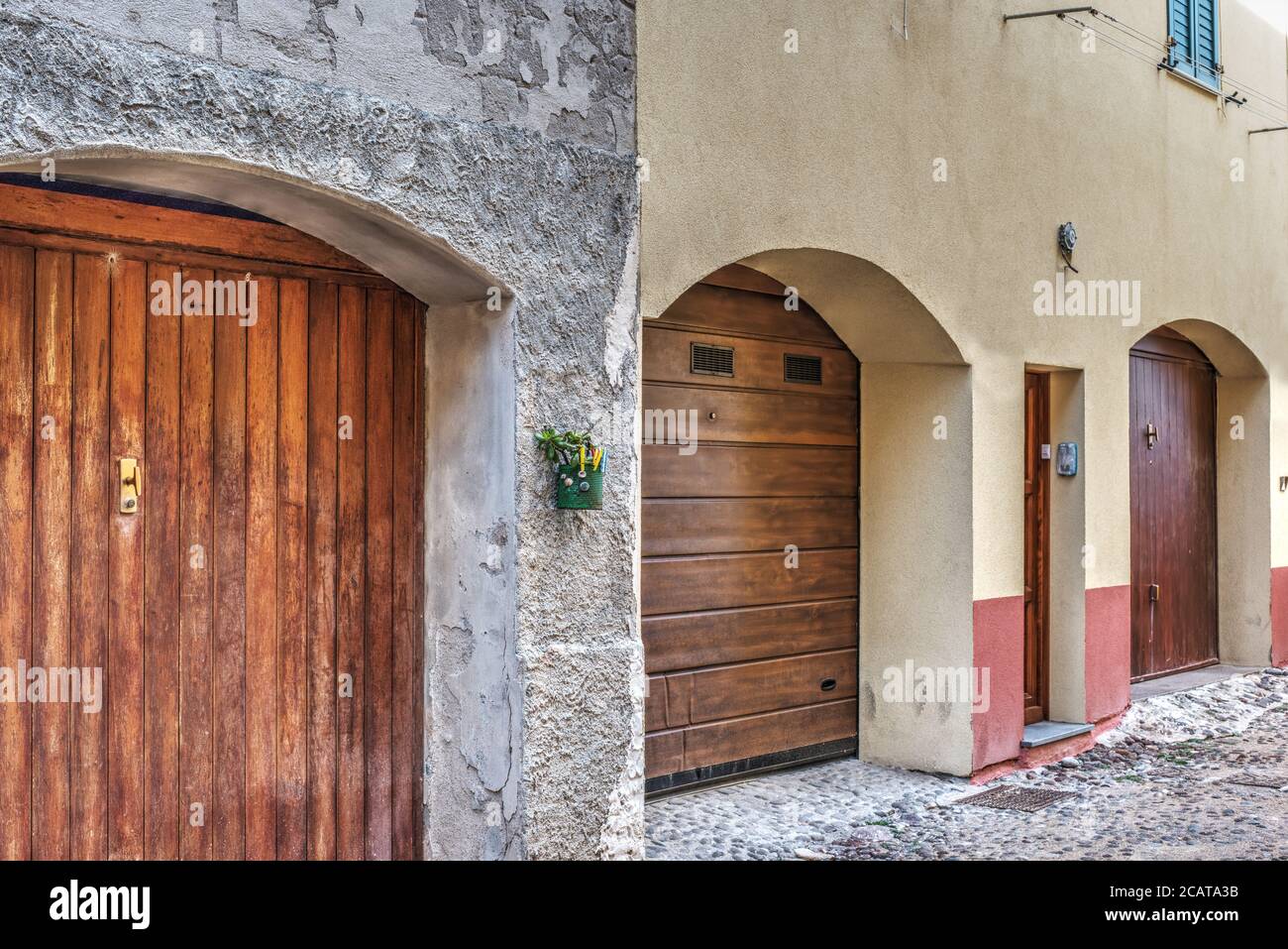 wooden doors in an old street in Sardinia, Italy Stock Photo - Alamy