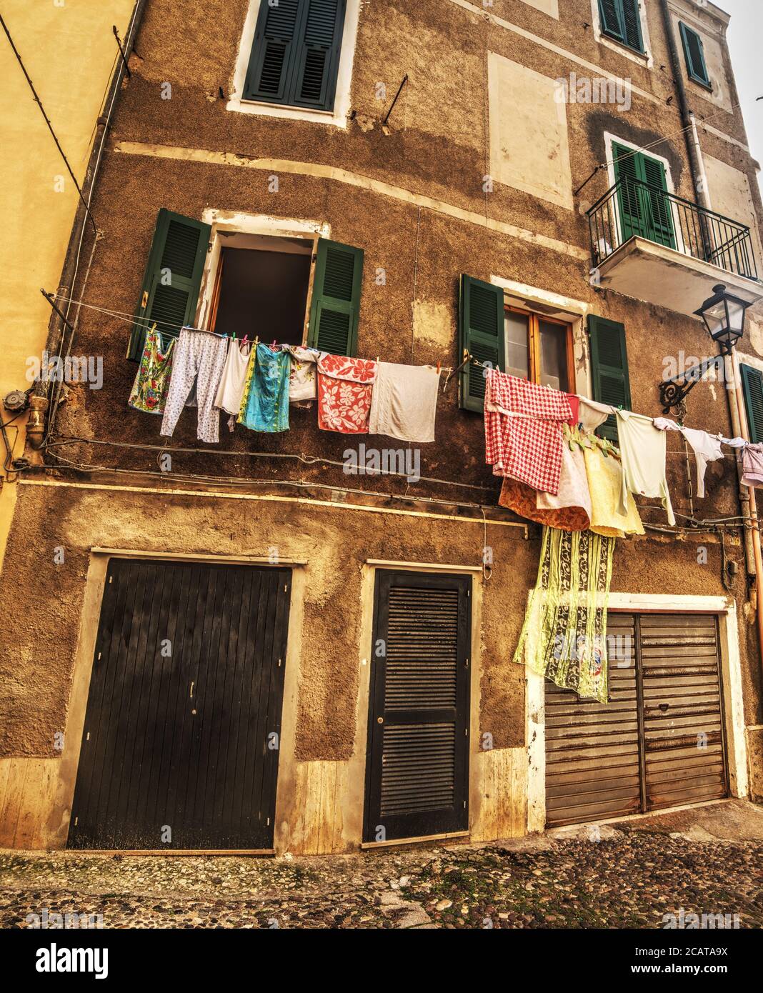 laundry line in an old town in Italy Stock Photo - Alamy