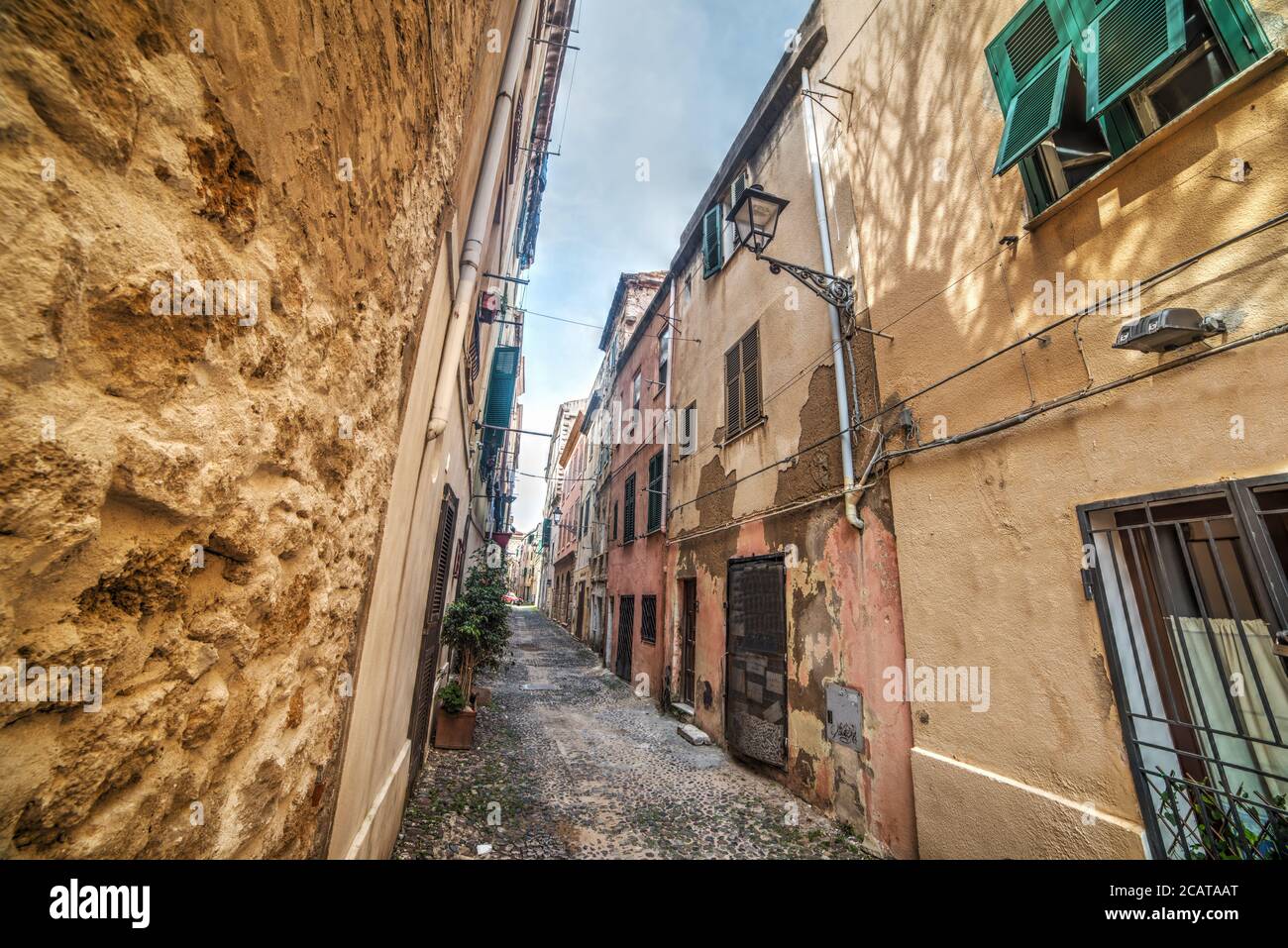 narrow street in Alghero old town, Sardinia Stock Photo - Alamy