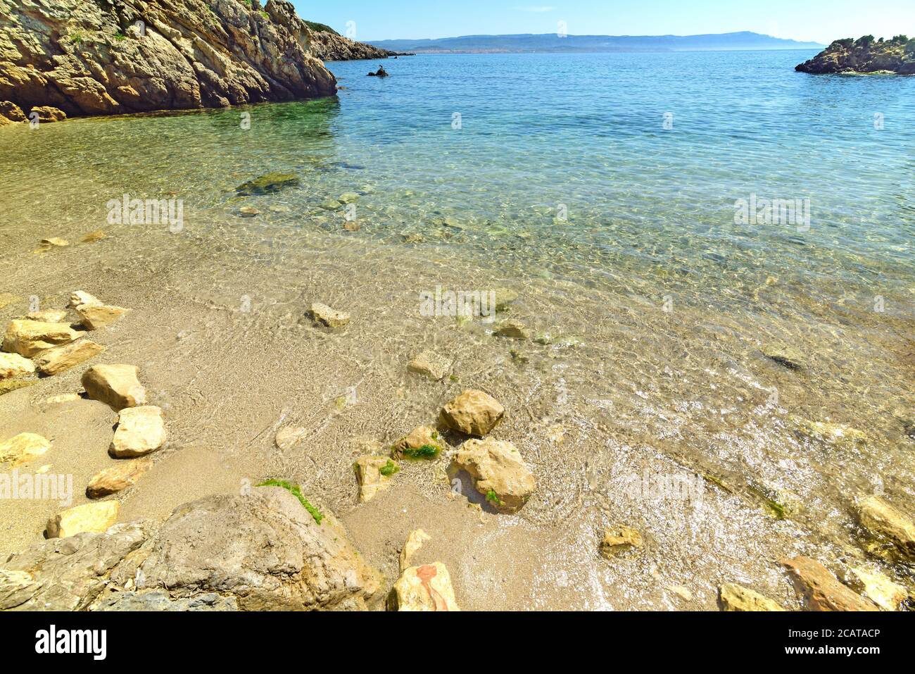 rocks and sand in Sardinia, Italy Stock Photo - Alamy