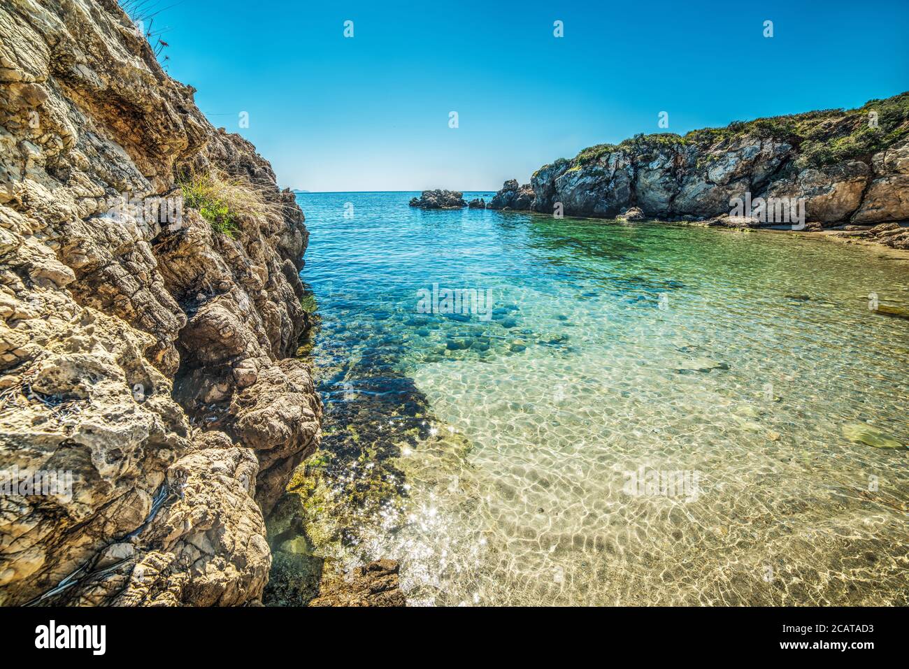 rocks and turquoise water in Sardinia, Italy Stock Photo - Alamy