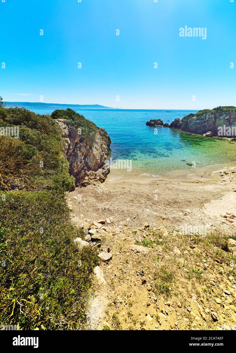small cove on a clear day in Sardinia, Italy Stock Photo - Alamy