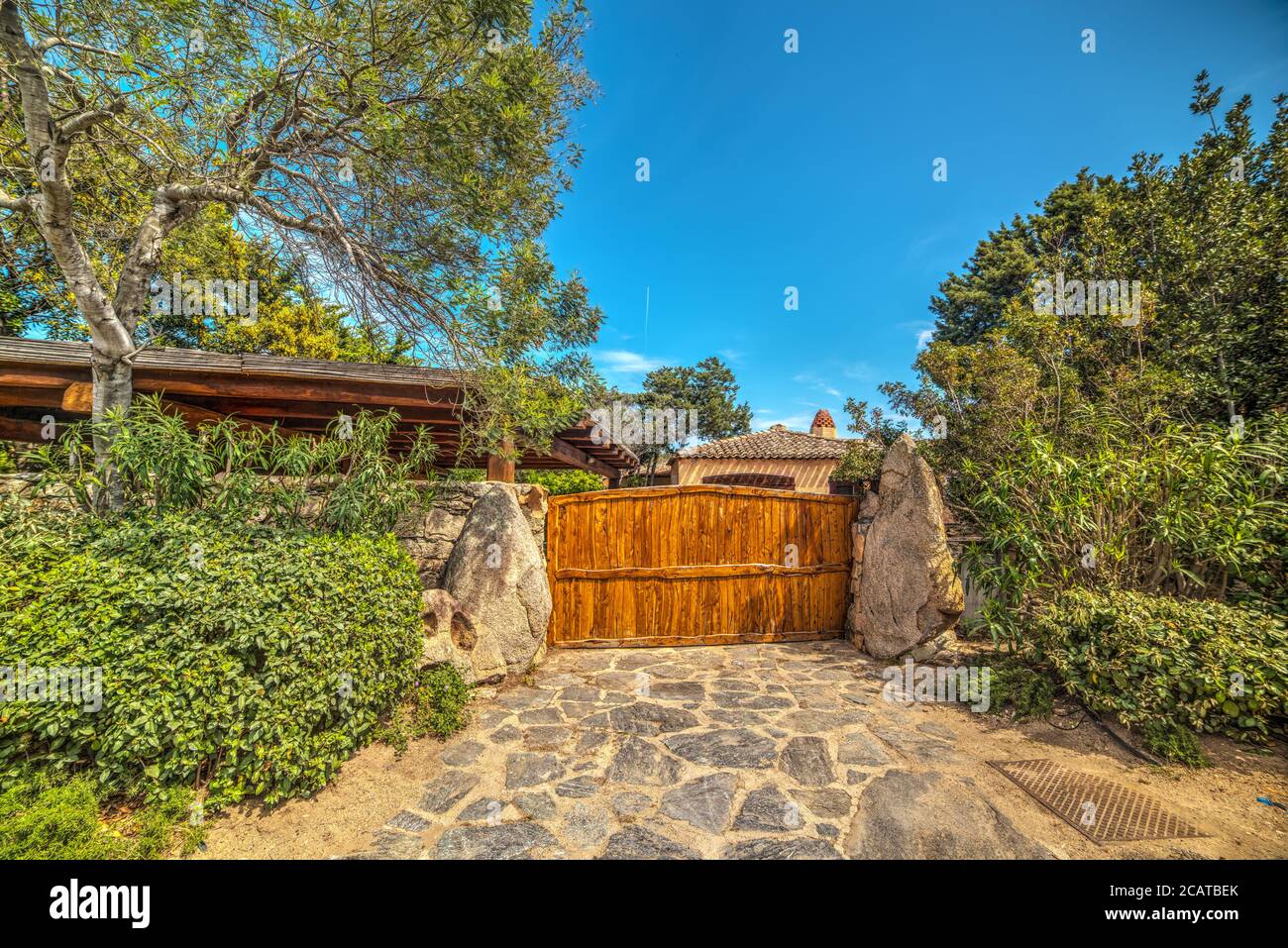 wooden gate of a luxury house in Italy Stock Photo - Alamy