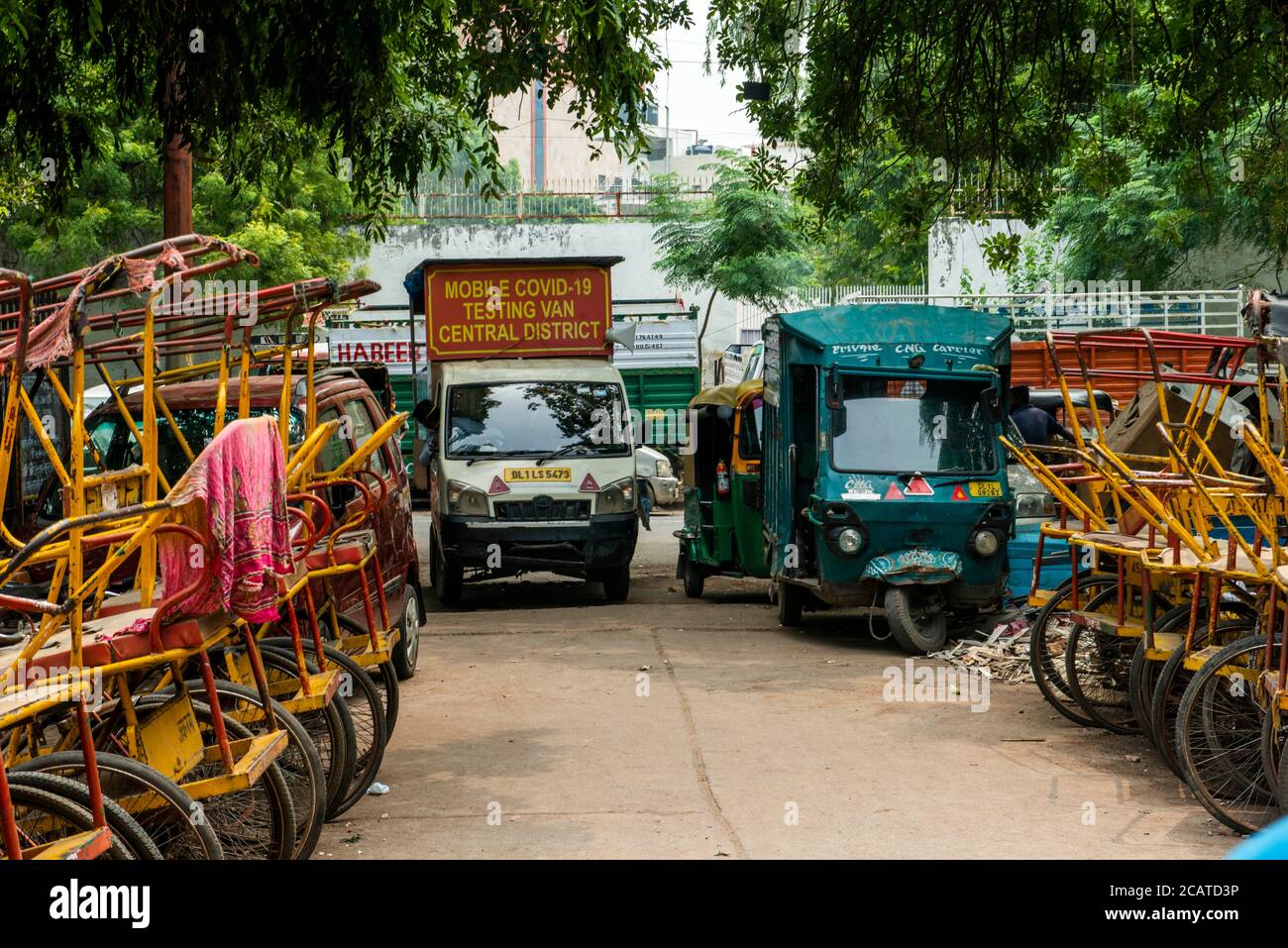 Testing van driving through a narrow lane during the tests.The mobile ...