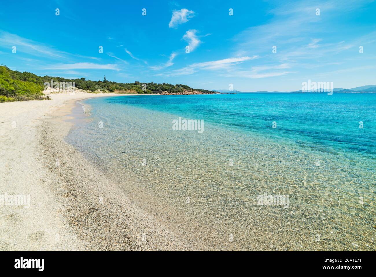 La Celvia beach under a blue sky, Sardinia Stock Photo - Alamy