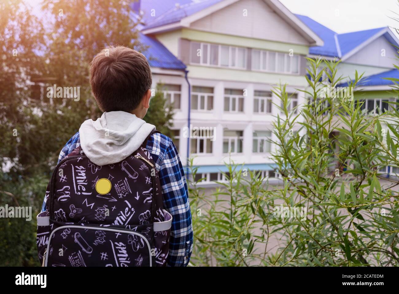 Irkutsk, Russia - August 05, 2020: Child boy with bag looks to ...
