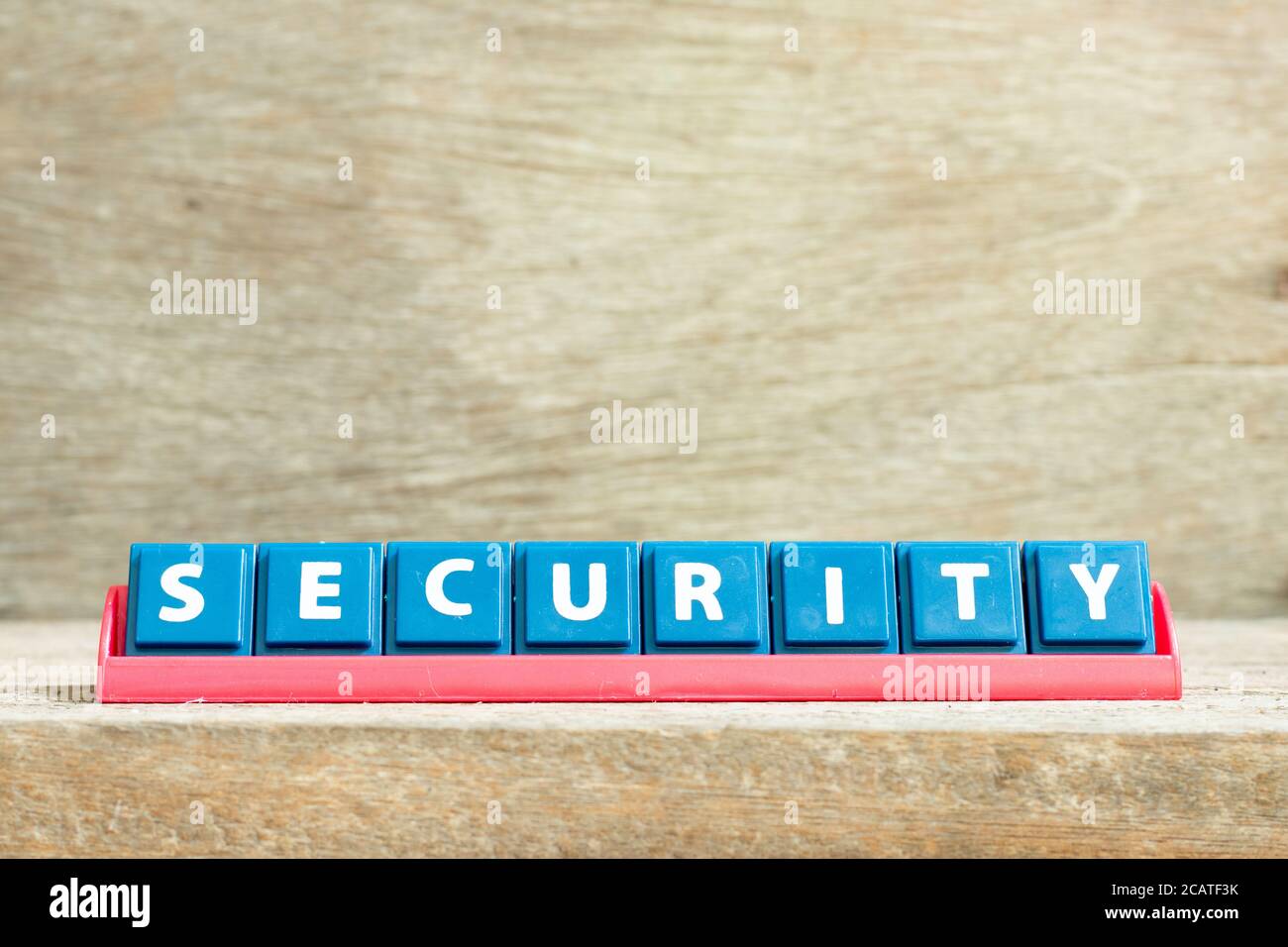 Tile letter on red rack in word security on wood background Stock Photo ...