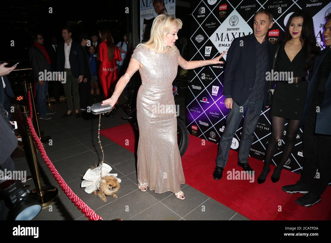 Christa Billich arrives on the red carpet for the Maxim magazine fifth ...