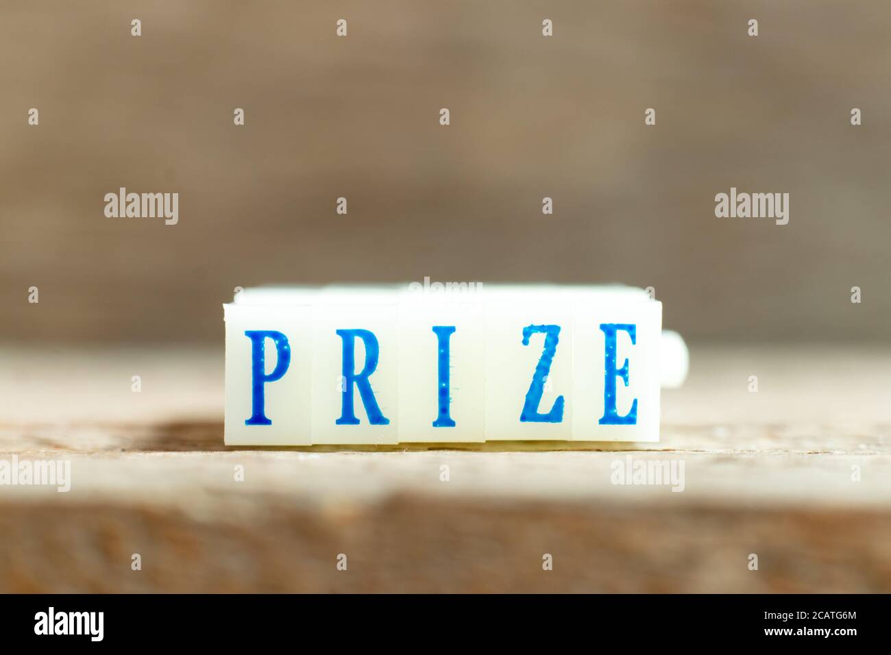 Letter block with blue color word prize on wood background Stock Photo ...