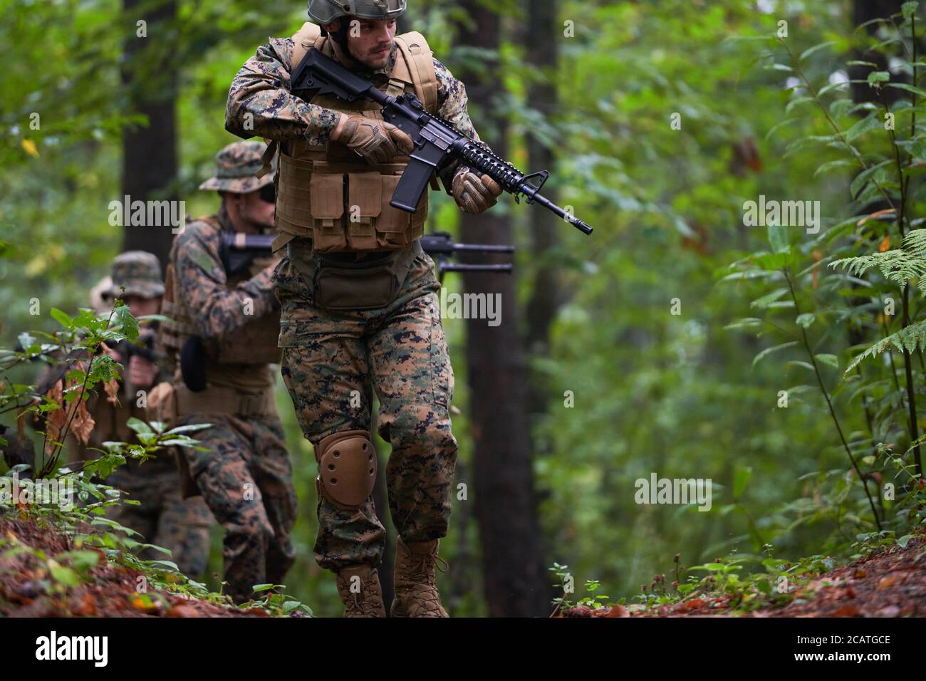 Modern warfare Soldiers Squad Running as Team in Battle Formation Stock ...
