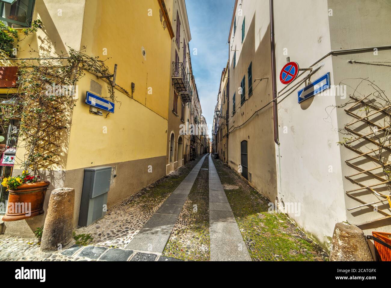 narrow street in Alghero old town, Sardinia Stock Photo - Alamy